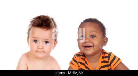 Two happy babies of different races isolated on a white background ...