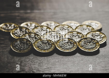 New pound coins currency lined up in pattern. Finance and business ...