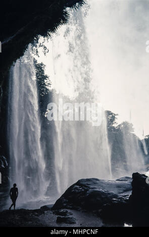 Woman on amazing waterfall background Stock Photo - Alamy
