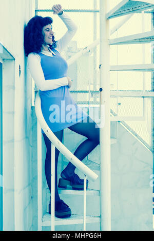 Beautiful Model standing on stairs Stock Photo - Alamy