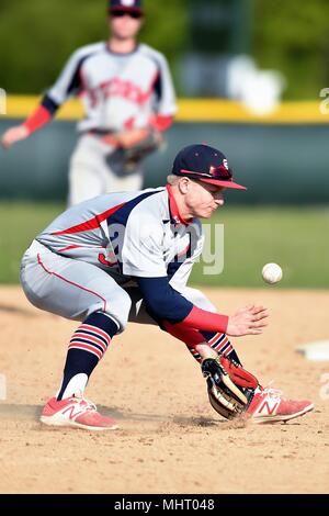 Shortstop fielding a ground ball prior to the throwing the batter out ...