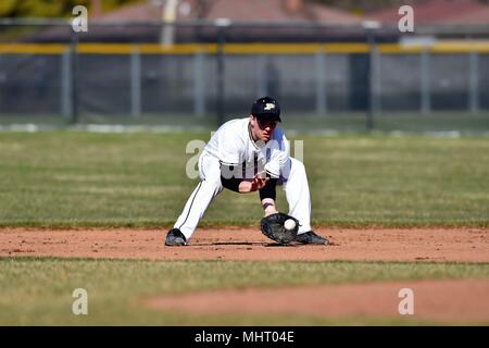 Shortstop fielding a ground ball prior to the throwing the batter out ...