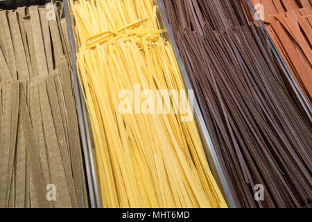 diffrent kind of colorful italian made pasta on display for sale Stock ...
