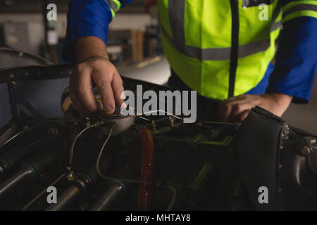 Plane Maintenance Engineer Repairing Engine Stock Photo - Alamy