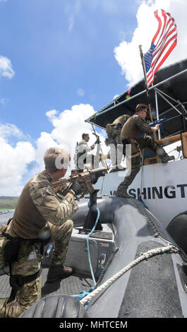 Royal Marines in a Rigid Hull Inflatable Boat (RIB), accompanying HMS ...