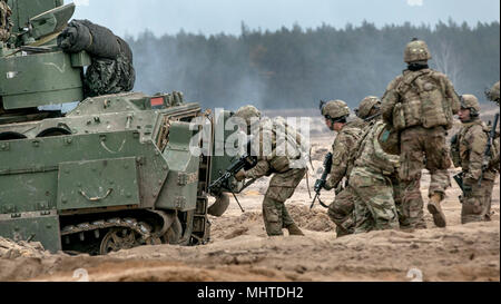 Soldiers enter an M2 Bradley Infantry Fighting Vehicle during Exercise ...