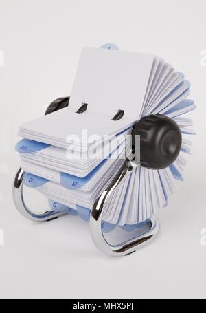 Note and rotary card file on man's desk Stock Photo - Alamy