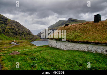 Faer Oer Island view on cloudy background Stock Photo - Alamy