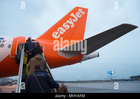 Passengers boarding an Easyjet flight at Schiphol Airport in Amsterdam ...