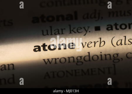 atone word in a dictionary. atone concept Stock Photo - Alamy