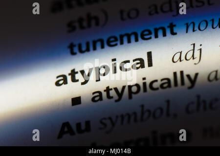 atypical word in a dictionary. atypical concept Stock Photo - Alamy