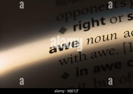 awe word in a dictionary. awe concept Stock Photo - Alamy