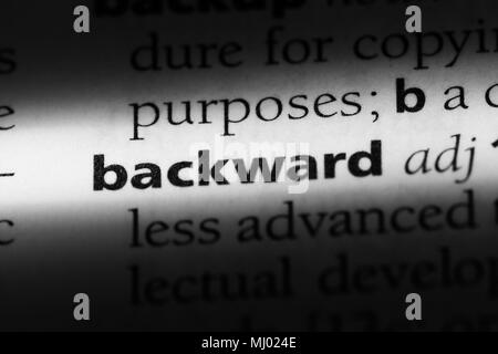 backward word in a dictionary. backward concept Stock Photo - Alamy
