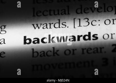 backwards word in a dictionary. backwards concept Stock Photo - Alamy