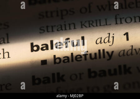 baleful word in a dictionary. baleful concept Stock Photo - Alamy