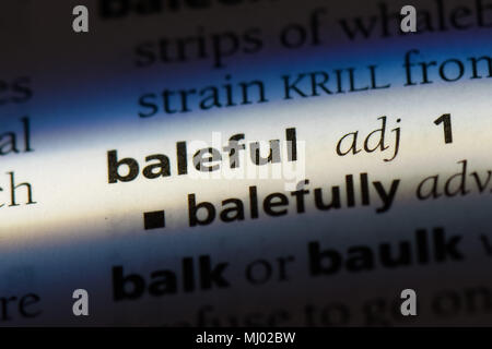 baleful word in a dictionary. baleful concept Stock Photo - Alamy