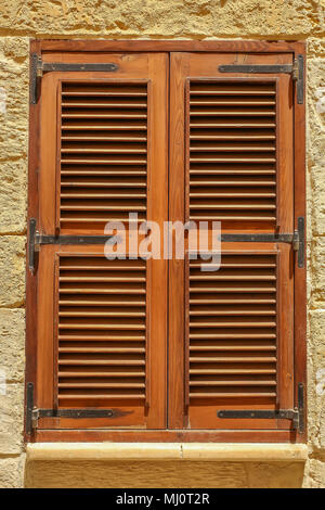 Historic house with window shutters and simple triangular gable in ...