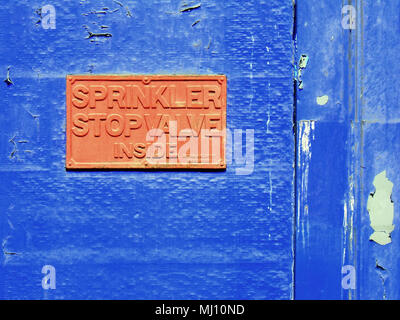 Sprinkler stop valve inside, old cast iron sign Stock Photo - Alamy