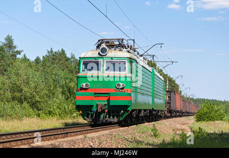 Russian freight train with electric locomotive pulling oil tankers ...