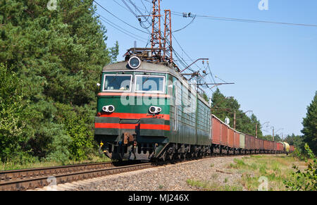 Russian freight train with electric locomotive pulling oil tankers ...