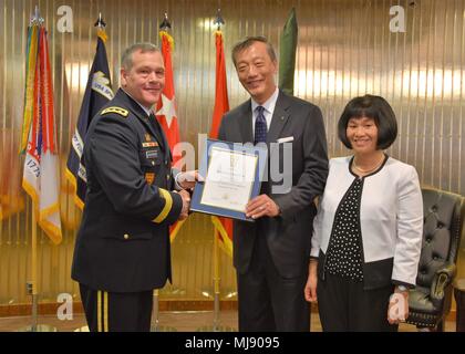 The Senior Executive Service certificate and SES pin is in place before ...