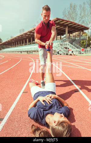 Runners on the stadium track. Women summer fitness workout Stock Photo ...