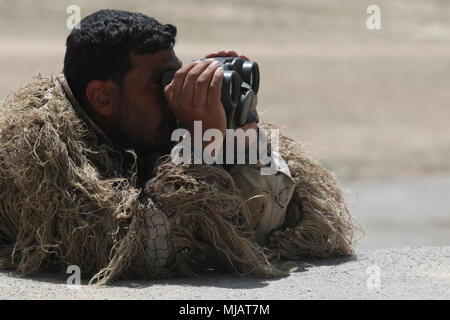 An Afghan National Army sniper provides security near the Ali Sheer ...