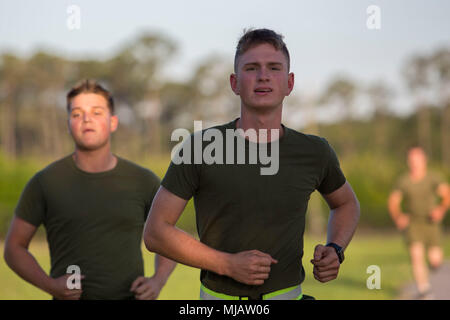 Marines conduct the run portion of the Physical Fitness Test aboard ...