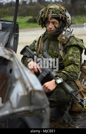 A Soldier assigned to the 39th Canadian Brigade Group holds a defensive ...