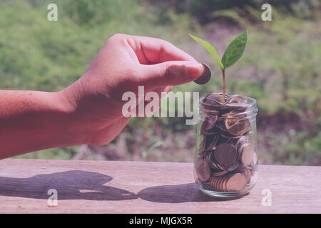 hand putting money coins with filter effect retro vintage style Stock ...