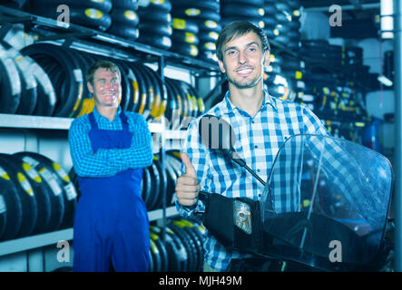 happy man customer holding his motorcycle Stock Photo - Alamy