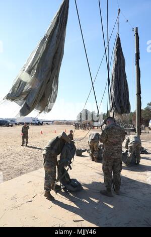 U.S. Army riggers assigned to the 824th Quartermaster Company prepare ...