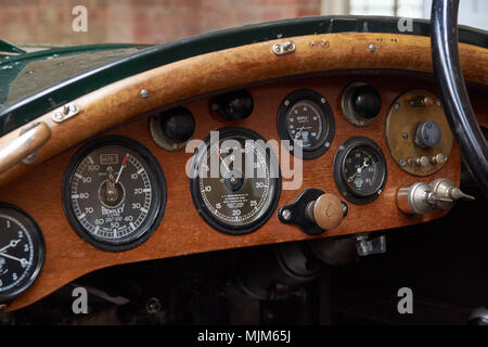 Dashboard and steering wheel of vintage Bentley car showing throttle ...