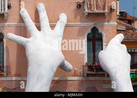 A sculpture of giant white hands by artist Lorenzo Quinn to highlight ...