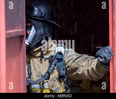 Civilians with Camp Pendleton Fire Department fill up a cooler with ...