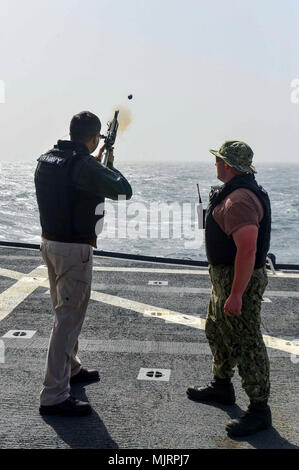 Gunner’s Mate 1st Class Adrian Rodziewicz loads an M203 grenade ...