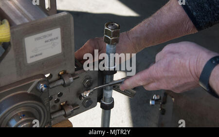 Dan Halliday, the creator of Halliday Technologies, tightens a strut on ...