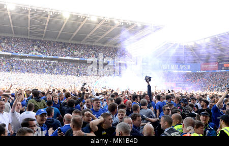 Cardiff City fans flood the pitch to celebrate their promotion to the ...