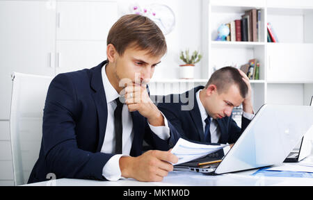 business male assistants making mistake Stock Photo - Alamy