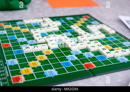 Kids playing scrabble game Stock Photo - Alamy