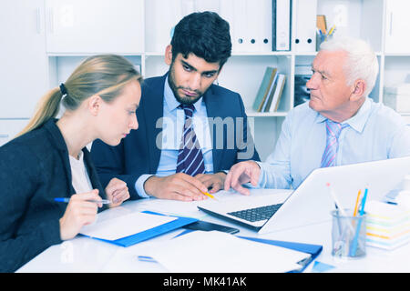 Office workers are writing financial reports in the office Stock Photo ...