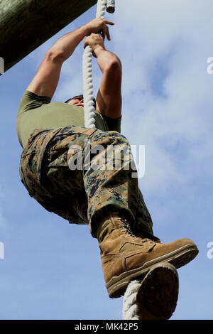 Marines, climb a rope during the Headquarters and Headquarters Squadron ...