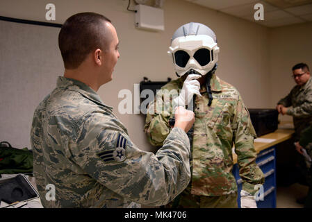 Airman 1st Class Matthew Scherbel, left, an aircrew flight equipment ...