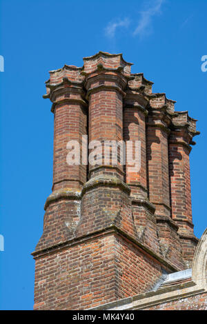 Elaborate red brick Tudor chimneys - no two quite alike - seen against ...
