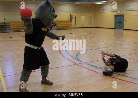 Sgt. Rocky, 3rd Infantry Division's mascot, poses with spouses from 3rd ...