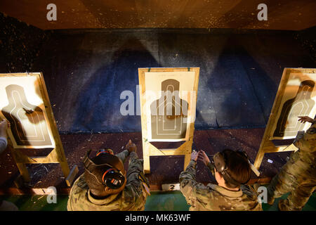 An alternate M9 pistol qualification course scorecard, magazines, an M9 ...