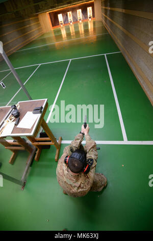 An alternate M9 pistol qualification course scorecard, magazines, an M9 ...