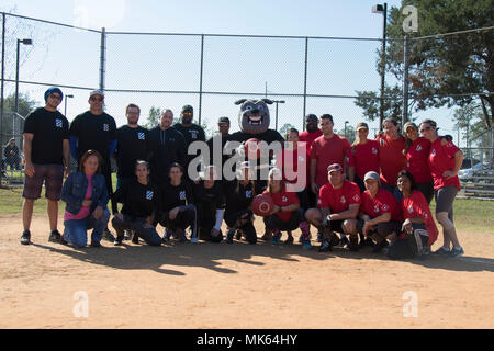 Rocky, the 3rd Infantry Division mascot, poses with a statue of Stock ...