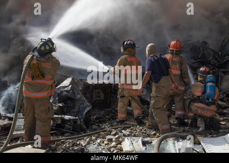 SAN JUAN, Puerto Rico – Firefighters battle a blaze at Homeca Recycling ...
