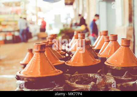 Preparing food in tajin traditional dish in Morocco - meat and ...